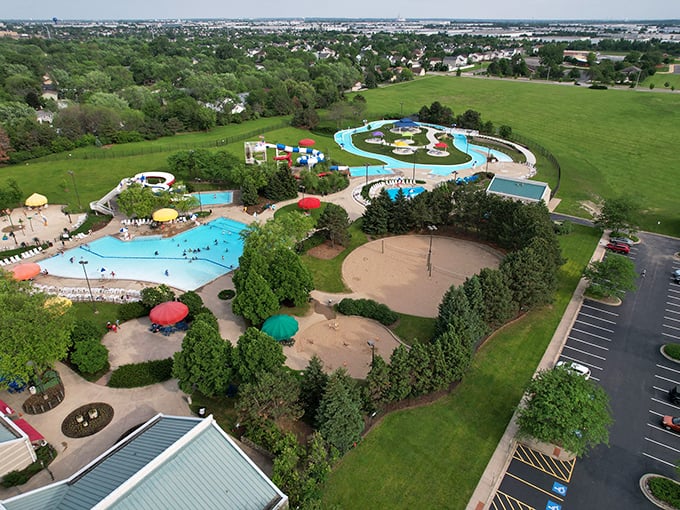 A bird's eye view of summer bliss! Pelican Harbor unfurls like a watercolor painting, each splash of blue a promise of adventure.