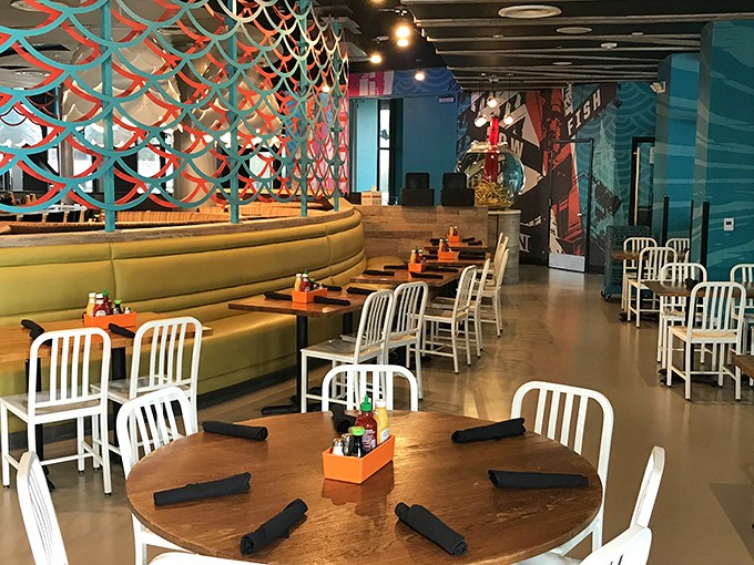 Step into a world where sushi meets burgers in perfect harmony. This dining area is like a colorful underwater dream come to life.