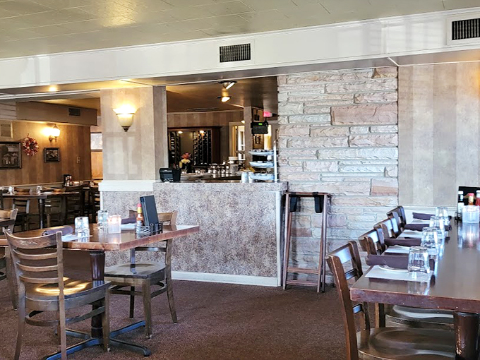 Cozy corners and rustic charm await! This dining area feels like your favorite aunt's living room, if she happened to be a gourmet chef.