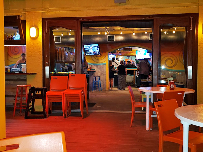 Step inside and feel the beach vibes wash over you. This dining area's colorful charm is as inviting as a gentle ocean breeze.