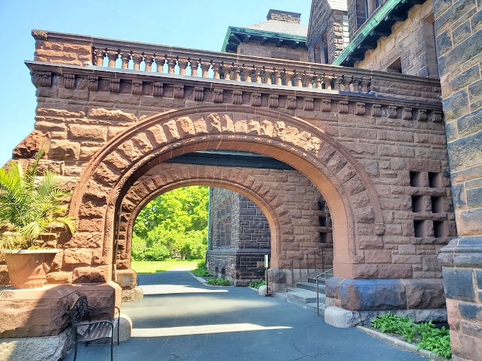 Step through this archway and you're not just entering a house, you're time-traveling to an era when "casual Friday" meant only three-piece suits.