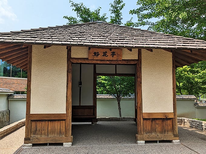 "Good Flower Pavilion" or "Great Place for a Nap"? This charming structure invites contemplation and perhaps a sneaky siesta.