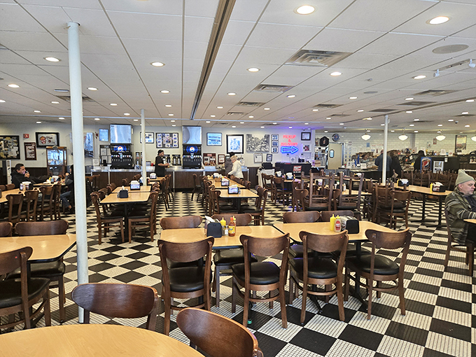 Checkered floors and wooden chairs - it's like a chessboard where the pawns are hungry patrons and the kings are piled-high plates.