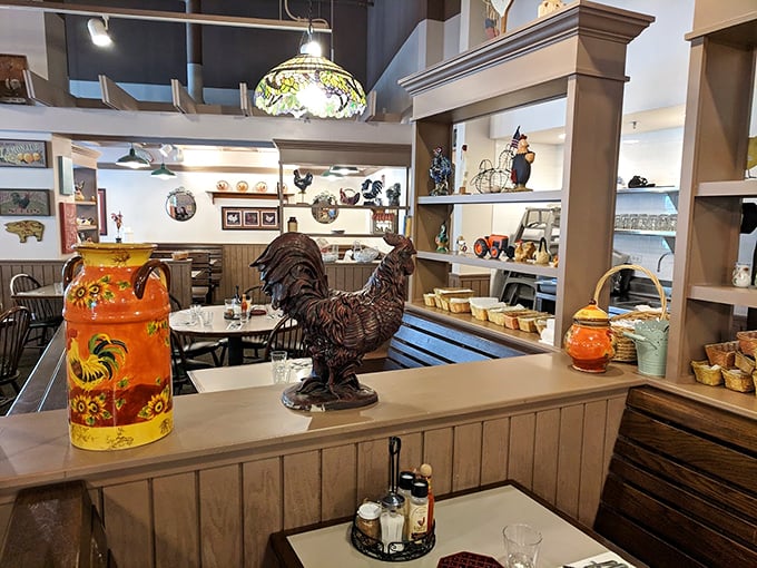 Step into breakfast wonderland! This cozy interior is like your grandma's kitchen got a Pinterest makeover, complete with enough rooster decor to start a farm.