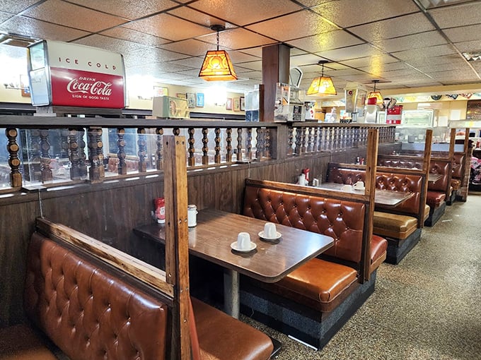 Step into a time machine of taste! Classic diner booths and vintage Coca-Cola signs transport you to a simpler, more delicious era.