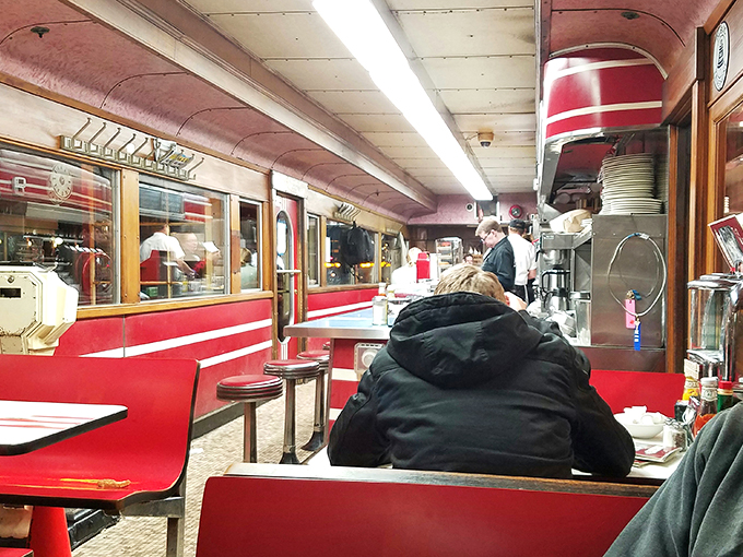 Slide into a slice of history! Mickey's interior is a cozy capsule of Americana, where every booth tells a story and every countertop holds a secret.