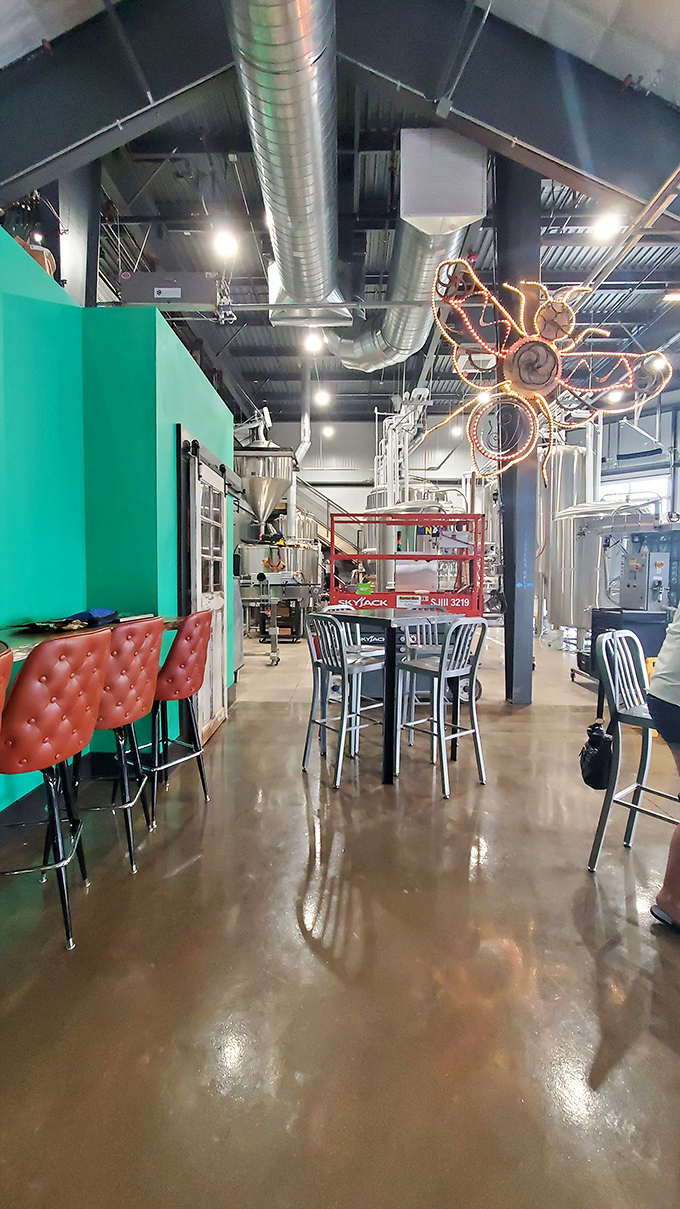 Step into a beer lover's paradise! The industrial-chic interior, complete with that funky light fixture, sets the stage for some serious brewing magic.