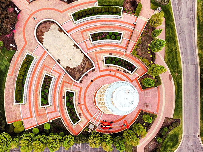 A bird's eye view that'll make your head spin! This aerial shot reveals the tower's whimsical surroundings, like a pizza with extra toppings.