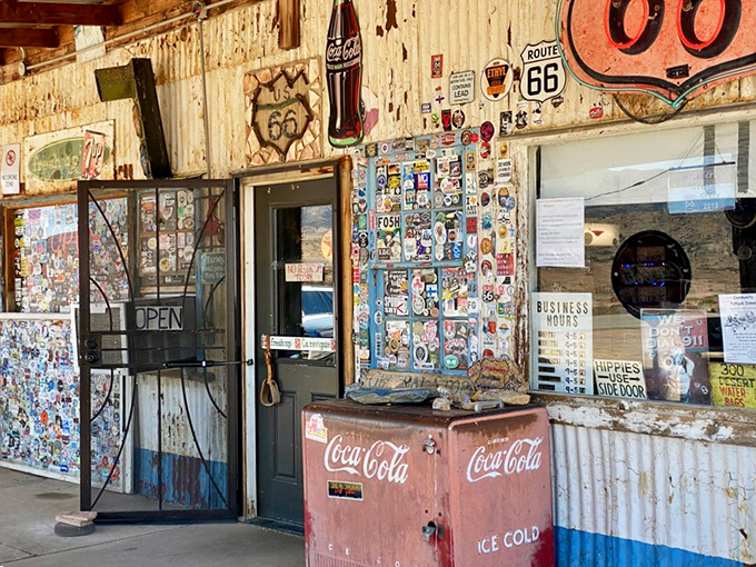 Step right up to the quirkiest entrance on Route 66! This door doesn't just lead to a store; it's a portal to a bygone era of road trip adventures and ice-cold Coca-Cola.