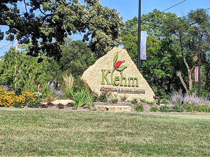 Welcome to Klehm, where even the entrance sign blooms with promise. It's like nature's version of a red carpet, minus the paparazzi.