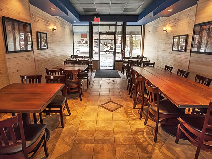 Step into a cozy haven where comfort food reigns supreme. Wooden tables and warm lighting set the stage for culinary magic.