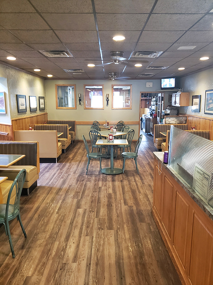 Step into a time machine disguised as a diner. This cozy interior has witnessed more family gatherings than a Thanksgiving turkey.