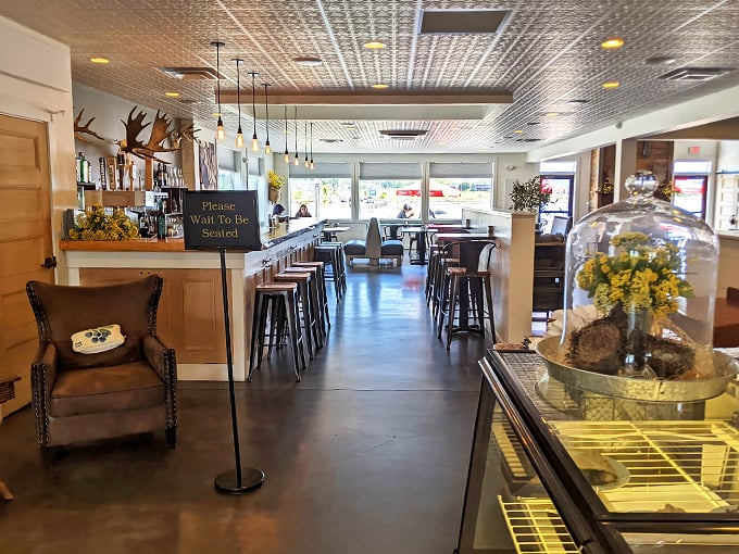 Step inside and feel the warmth. Helen's interior is a perfect blend of modern comfort and nostalgic charm, with a pressed tin ceiling that whispers tales of bygone eras.