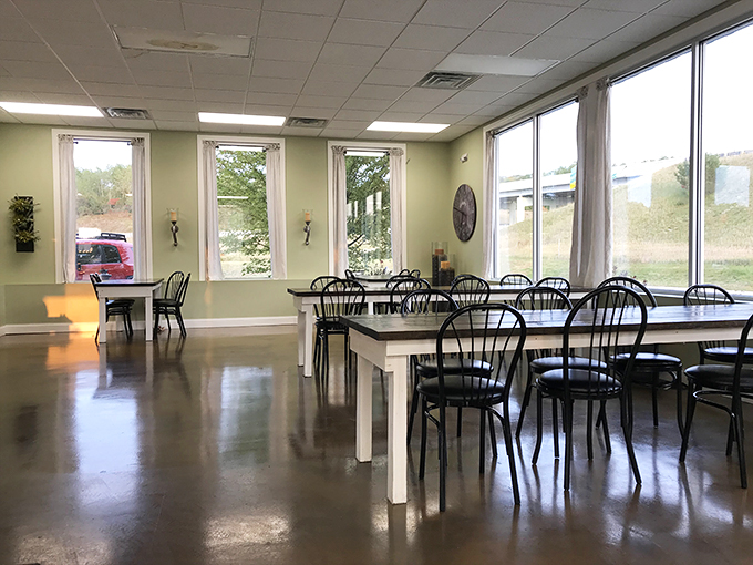 Step into a dining room cleaner than grandma's china cabinet. The light green walls and ample windows create an atmosphere fresher than spring chicken.
