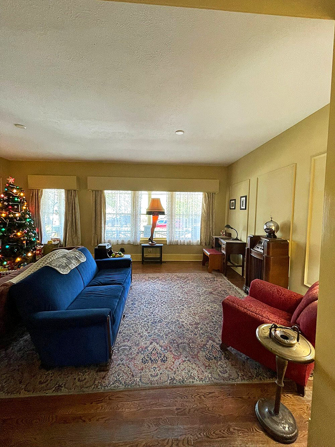 Step into the living room and feel the warmth of vintage charm. Is that the ghost of Christmas past or just the glow of the leg lamp?