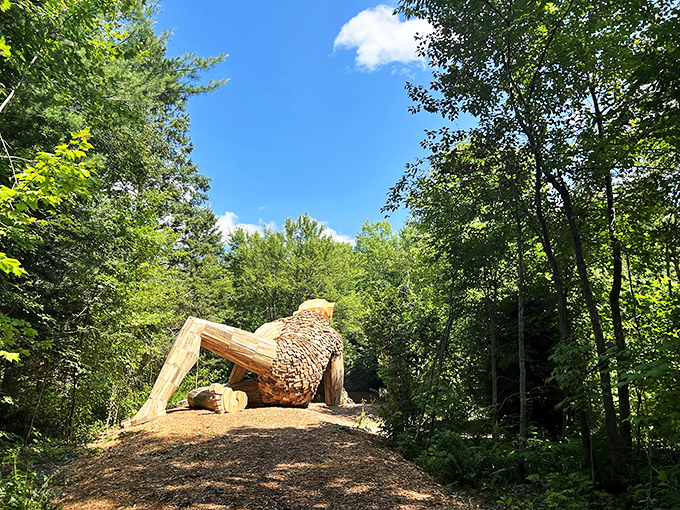 A troll with a view! Benny's backside blends seamlessly into the lush Michigan landscape, like a folktale come to life.