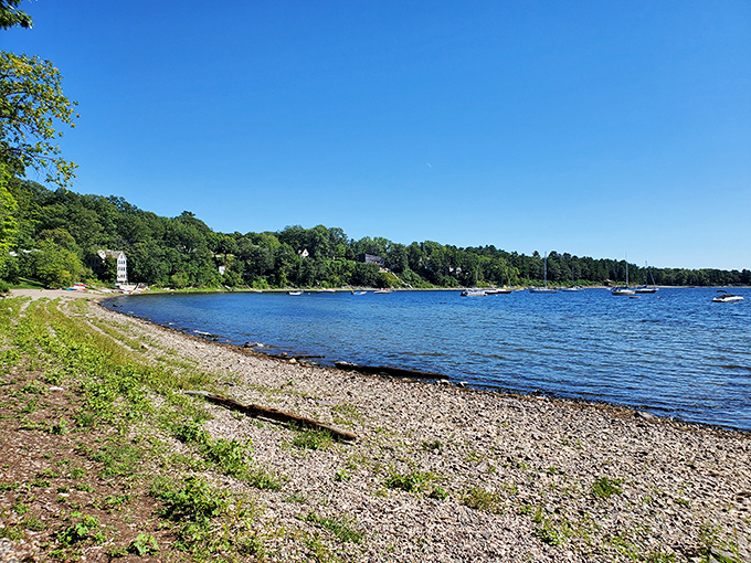 Lake Champlain's rocky catwalk: Where pebbles strut their stuff and boats strike a pose against the backdrop of Vermont's finest.