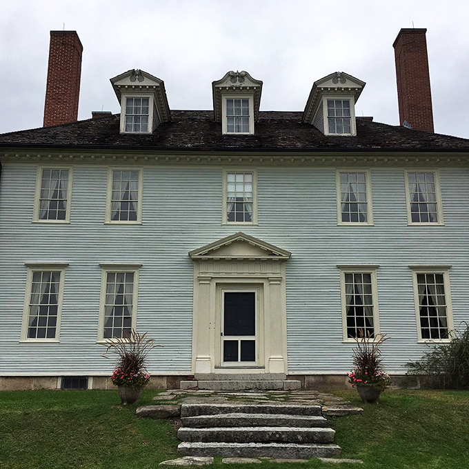 Knock knock! Who's there? History, and it's dressed to the nines. This grand entrance is your portal to a world of colonial elegance.