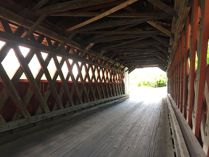 Wooden beams and latticed walls create a mesmerizing tunnel effect. It's like walking through nature's own kaleidoscope!