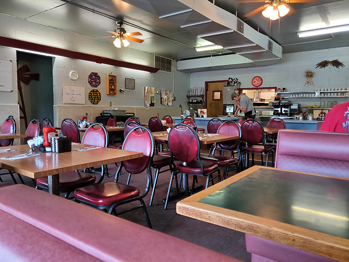 Step inside and prepare for a time warp! The Windmill Cafe's interior is a delightful mishmash of small-town charm and retro cool, like your favorite aunt's kitchen got a diner makeover.