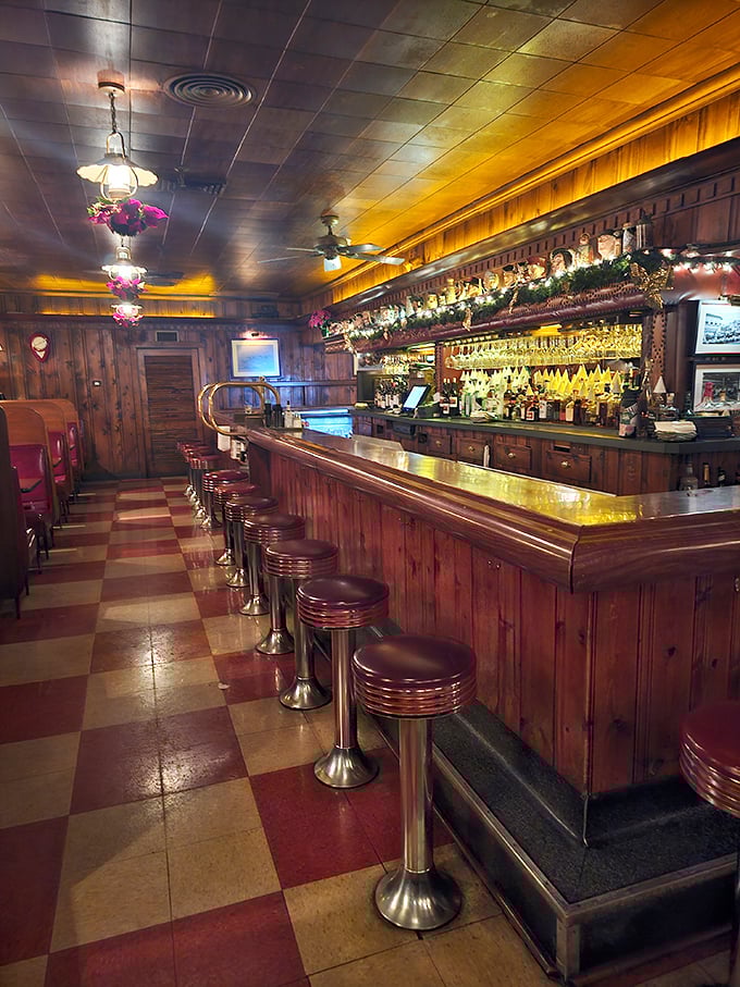 Step into a time machine disguised as a dining room. The Pine Club's wood-paneled interior and checkered floor transport you to an era when dinner was an event.