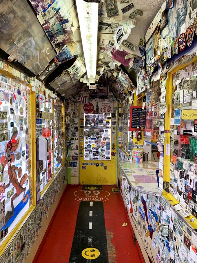 Talk about information overload! This hallway is like Instagram come to life, minus the filters. Every inch tells a story &ndash; or a thousand. It's a road tripper's dream scrapbook.