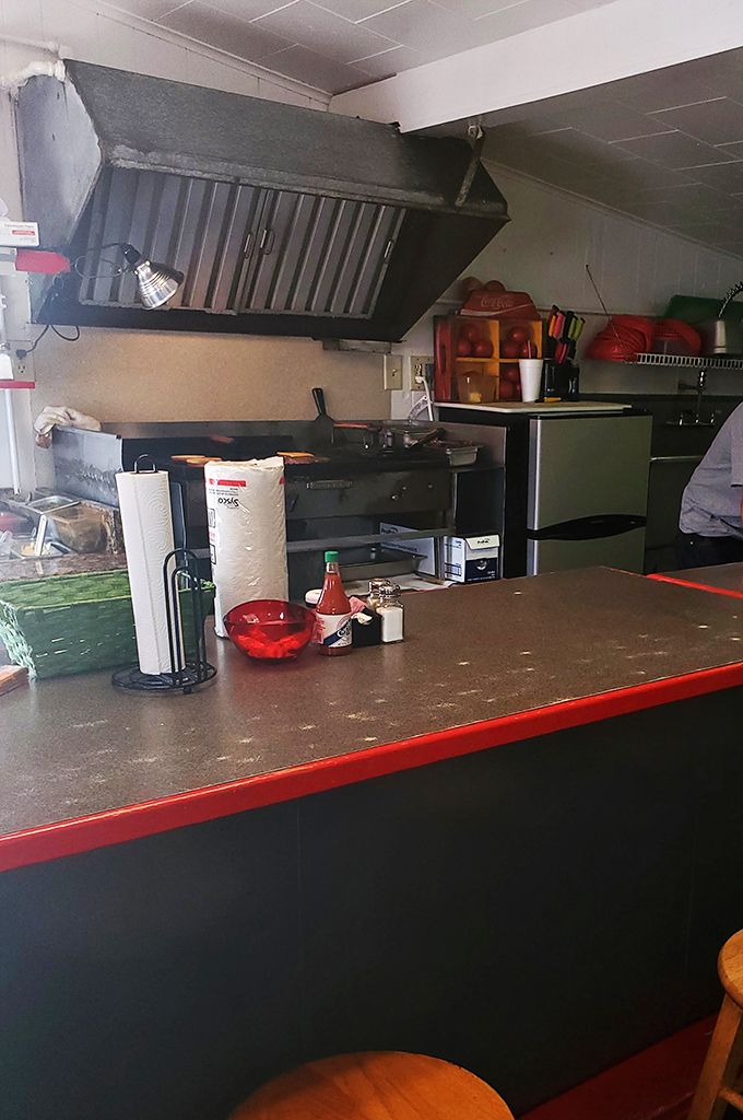 Where the magic happens! This no-frills kitchen is the engine room of flavor, churning out deliciousness with the efficiency of a well-oiled machine.