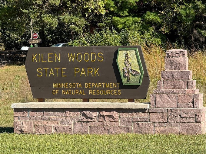 Kilen Woods State Park: Where Adventure Meets Serenity. This sign isn't just marking territory; it's practically winking at you, inviting you to explore.