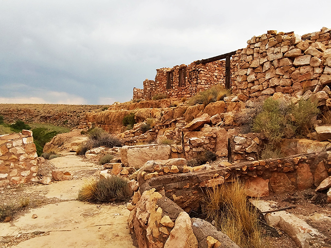 Desert meets ruins in this dramatic landscape. The weathered stone walls tell silent stories of Route 66's golden age.