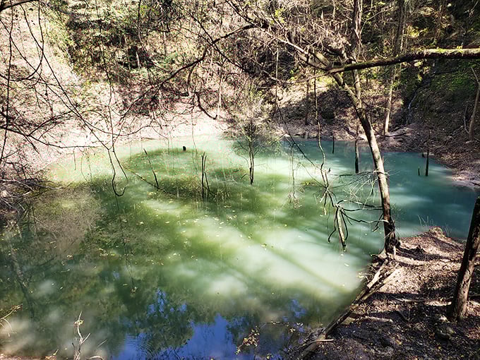 Mother Nature's own infinity pool, minus the cabana boys. This sinkhole's got more layers than a celebrity's PR team!