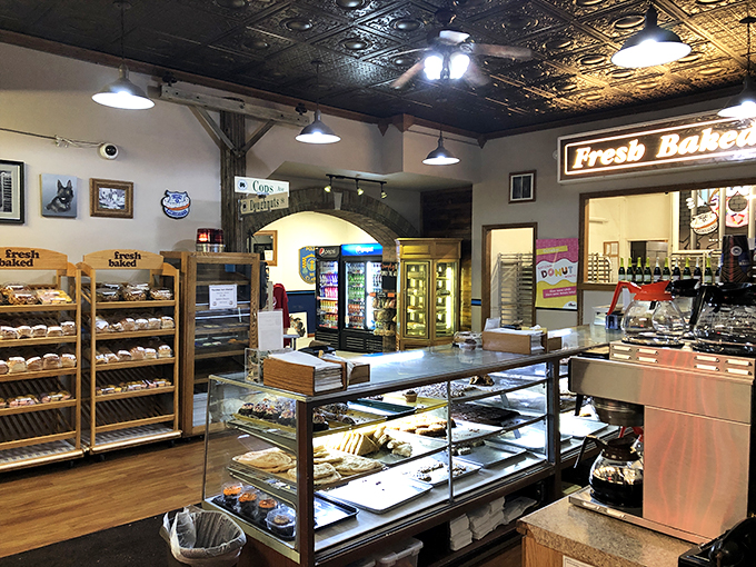 Step inside and enter a sugar-coated wonderland! The display cases are a treasure trove of temptation, each pastry vying for your attention like contestants on a delicious reality show.