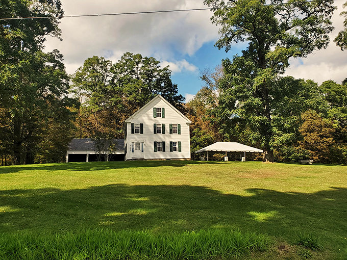 A storybook farmhouse come to life! This pristine white beauty looks ready to host a Norman Rockwell painting session.