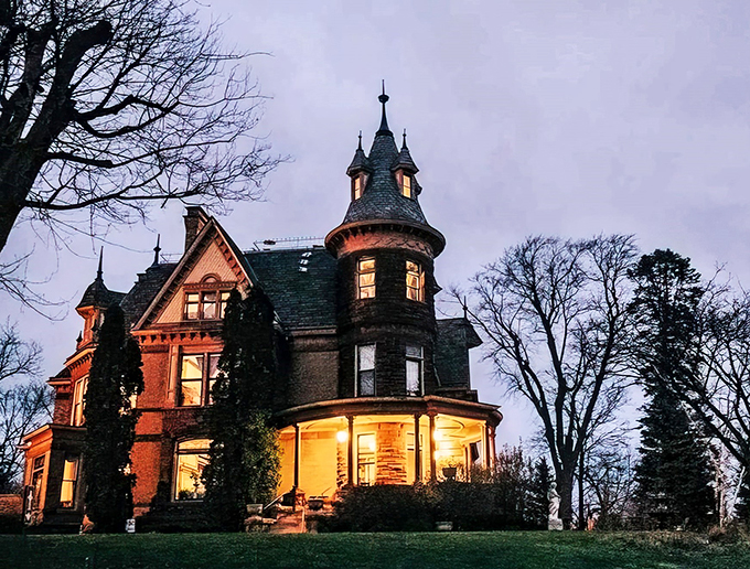 Castle living, Midwest style! This red brick beauty is serving up history with a side of goosebumps.