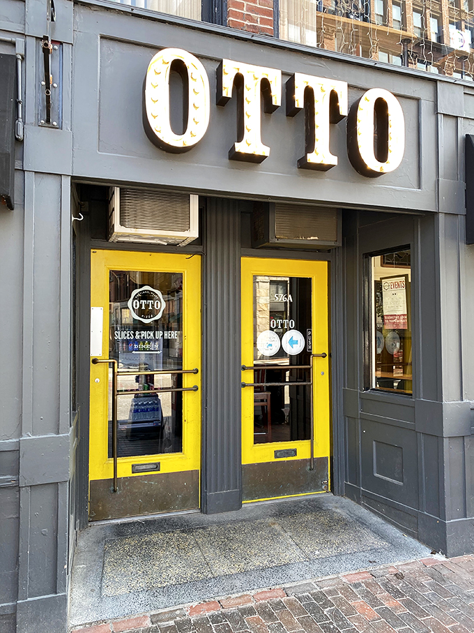 Otto's bold yellow doors are like a portal to pizza paradise. Step inside for a slice of Portland cool!