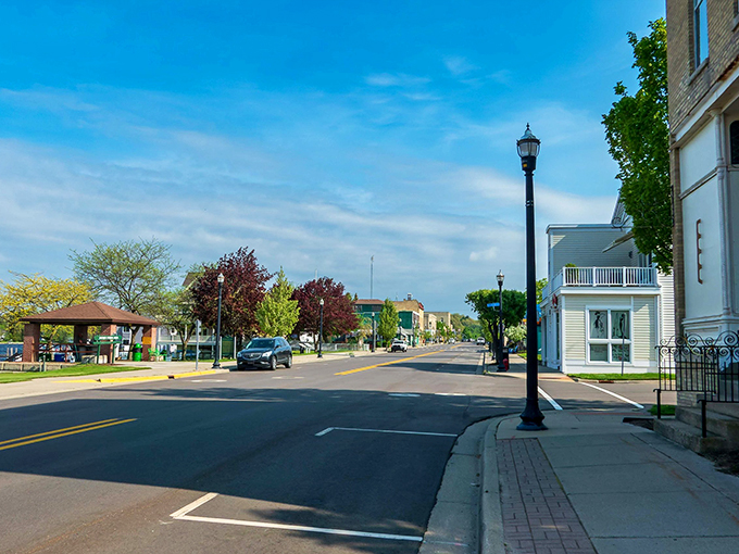 Pentwater: Where time slows down and charm speeds up. This picturesque main street is like a Norman Rockwell painting come to life.