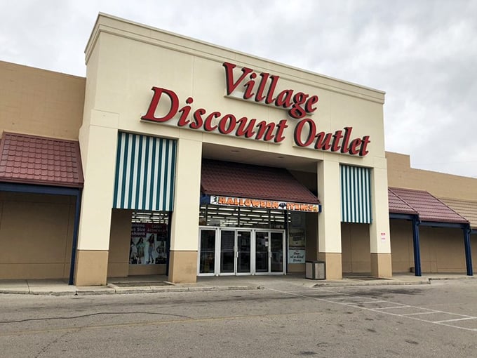 Discount dreams come true! Village Discount Outlet's bold sign promises a wonderland of wallet-friendly finds.