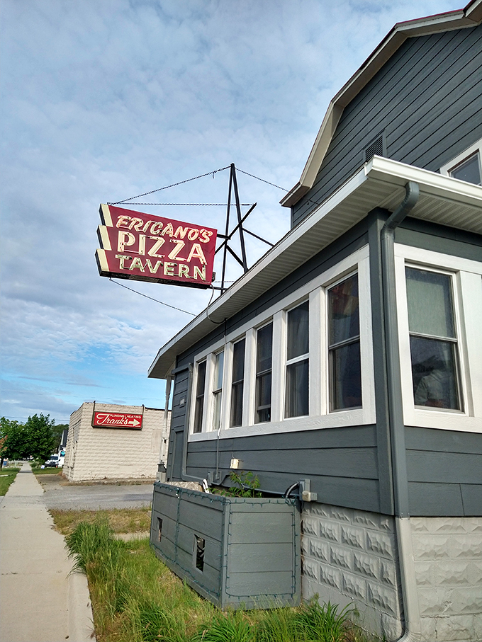 Neon dreams and pizza screams! Fricano's sign is like a beacon for hungry souls wandering the streets of Grand Haven.
