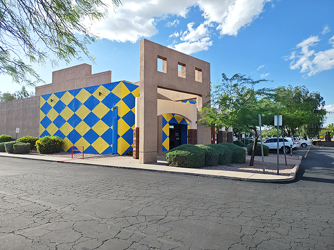 Blue and yellow checkers scream 'fun lives here!' Step inside for a slice of pizza and a side of musical magic.