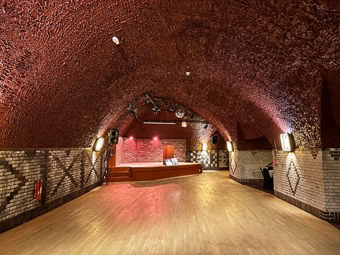 Inside the caves, this eerily empty dance floor still waits for phantom revelers. If you listen closely, you might hear the ghostly echoes of jazz from the Prohibition era.