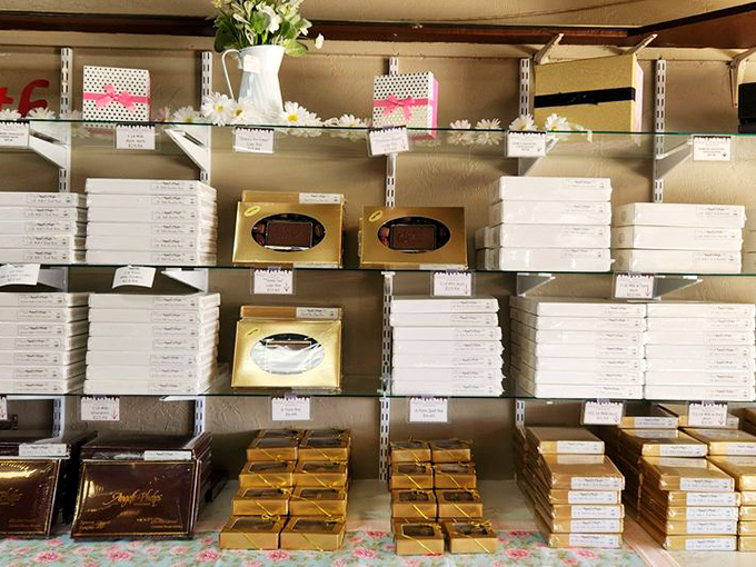 Boxes of joy, stacked with care. Each one a treasure chest of cocoa-covered delights, waiting to be discovered.