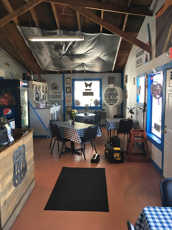 Step into a Norman Rockwell painting come to life! This cozy nook serves up comfort food with a side of time travel, all wrapped in a gingham tablecloth.