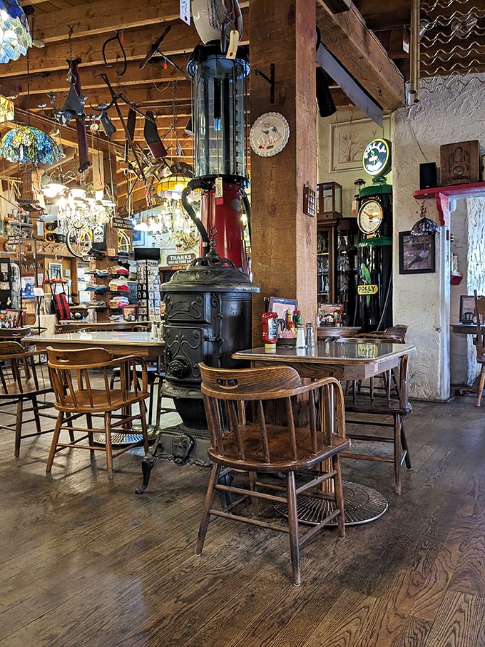 Pull up a chair to history! This rustic dining area feels like you've stumbled into Grandma's attic &ndash; if Grandma collected antique stoves and chandeliers.