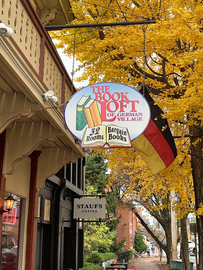 Fall in love with books all over again! The Book Loft's vintage sign, framed by golden leaves, promises 32 rooms of bargain-priced adventures.