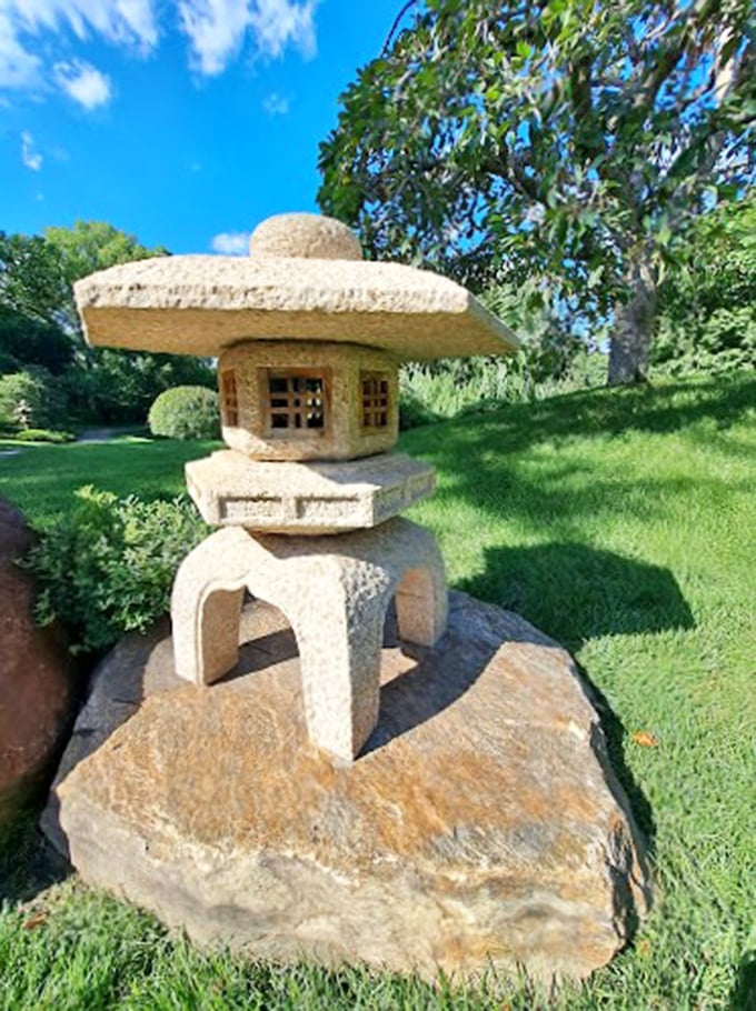 Stone pagoda or the world's fanciest bird feeder? Either way, it's a picture-perfect addition to this miniature Japanese landscape.