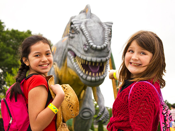 "Say cheese!" Or maybe "Say extinct!" These young explorers are all smiles next to their toothy new friend. Talk about a photogenic family reunion!
