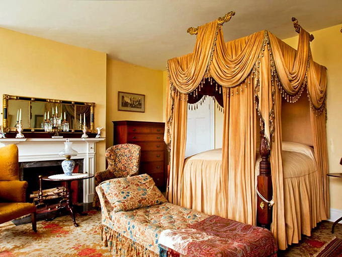 "Canopy beds: where dreams of royalty meet the reality of stubbed toes." This bedroom is straight out of a Jane Austen novel, minus the corsets.