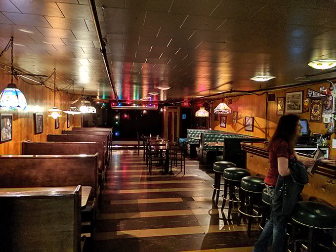 Step into a time capsule of cool! Wood paneling, vintage lighting, and cozy booths set the stage for intimate performances and late-night revelations.