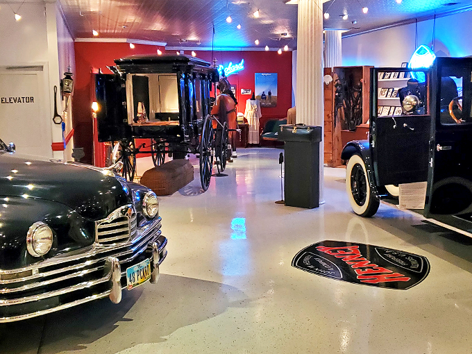 Step right up to the carnival of the departed! This eclectic showroom is where vintage hearses and classic cars mingle like old friends at a very unusual reunion.