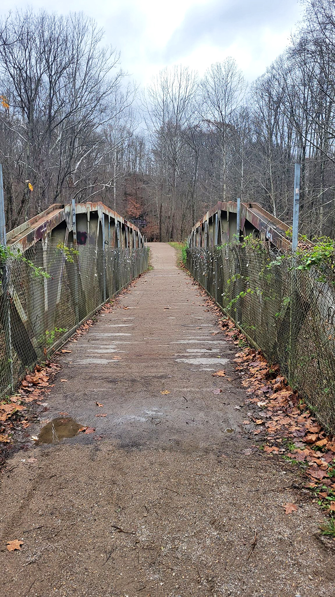 Bridging the gap between past and present: This weathered walkway leads intrepid explorers towards Moonville's mysterious heart.