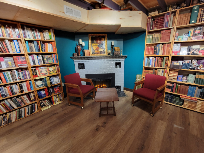 Cozy up to knowledge! This inviting nook, complete with a fireplace, is the perfect spot to curl up with a good book and forget the outside world exists.